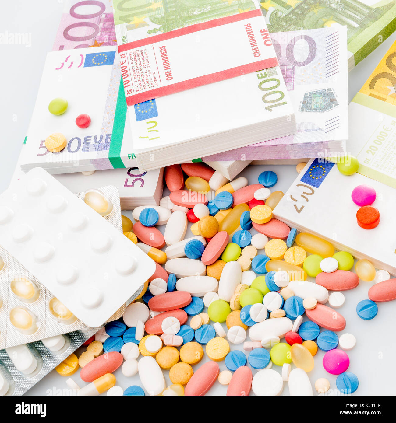 Money and pills. Pills of different colors on money. medicine concept ...