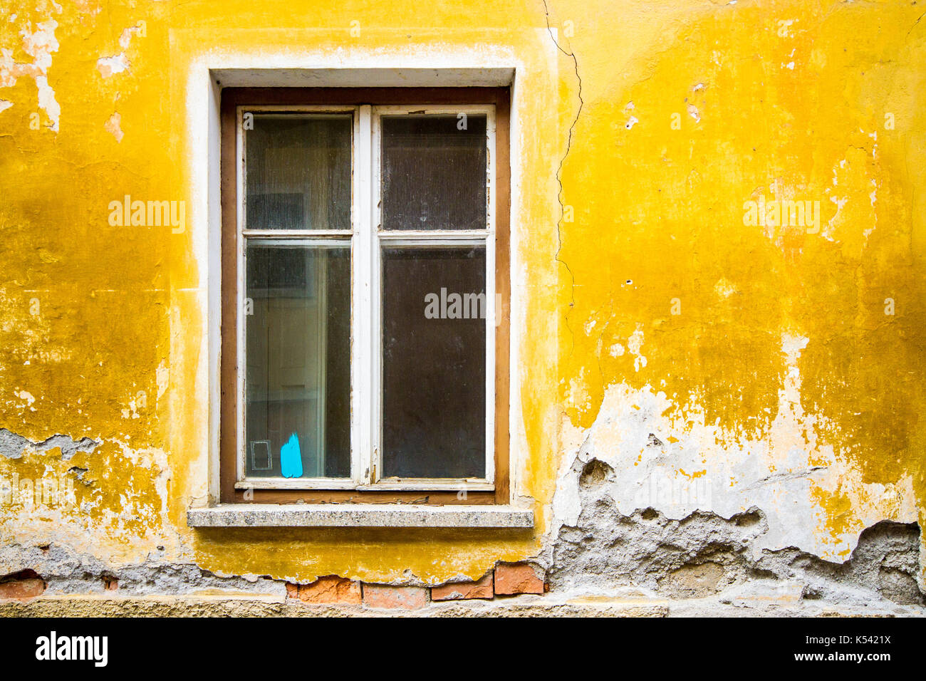 Old window of a decaying yellow building Stock Photo - Alamy