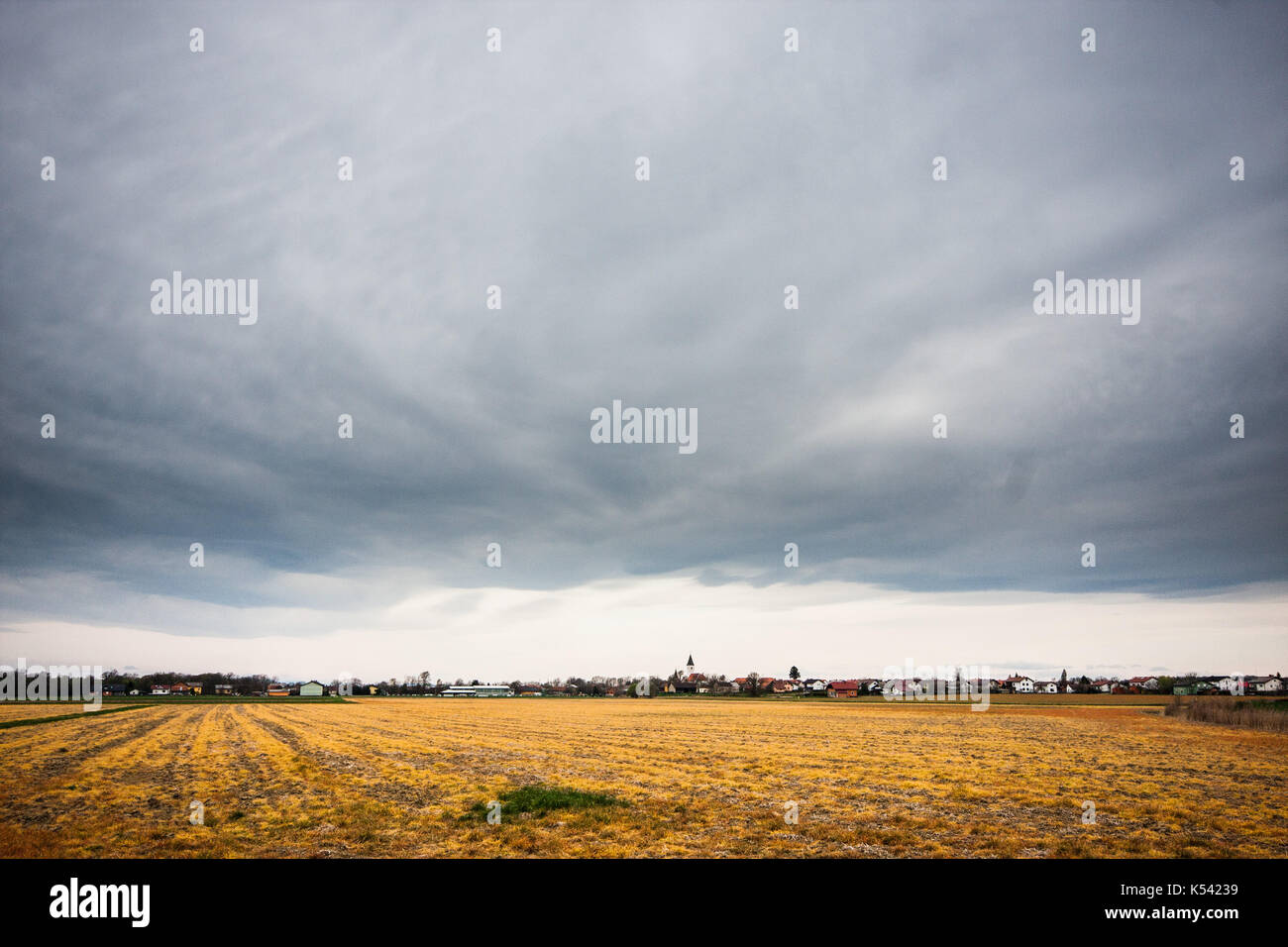 Cloudy skies over empty fields in Gorcko, Slovenia Stock Photo - Alamy