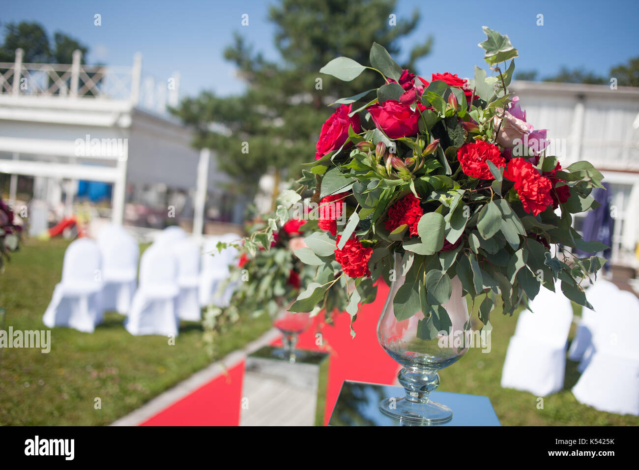 Wedding registration outdoor. Luxury bouquets with red flowers Stock ...