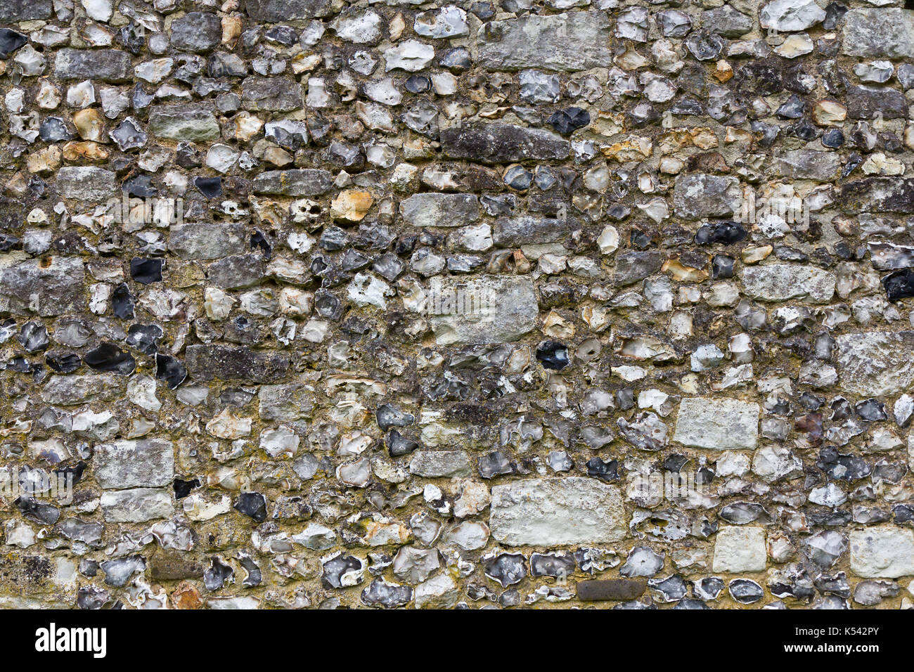 Flint garden wall for background texture Stock Photo - Alamy