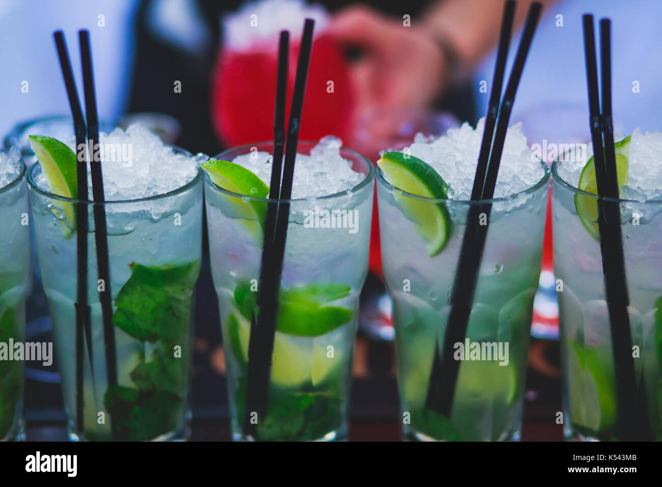 Beautiful line of different coloured alcohol cocktails on a open air ...