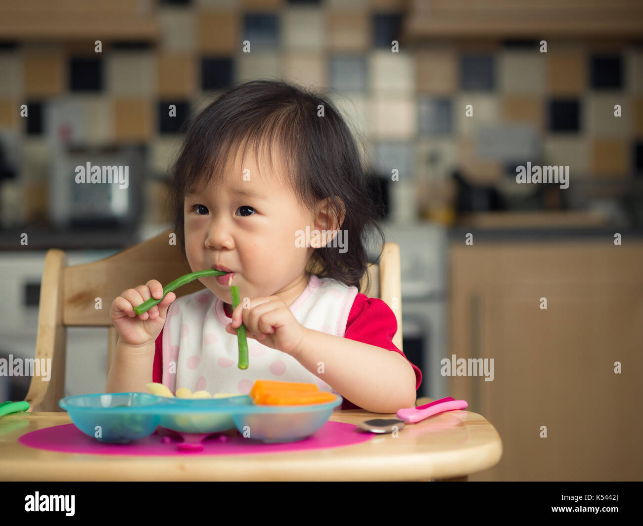 Kid eating beans hi-res stock photography and images - Alamy