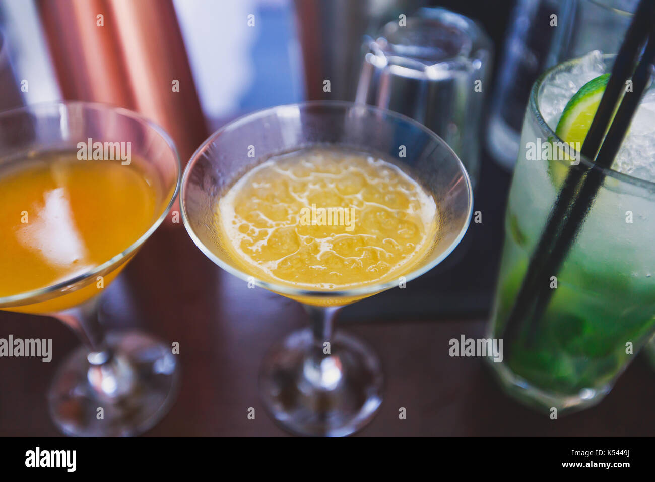 Beautiful line of different coloured alcohol cocktails on a open air ...