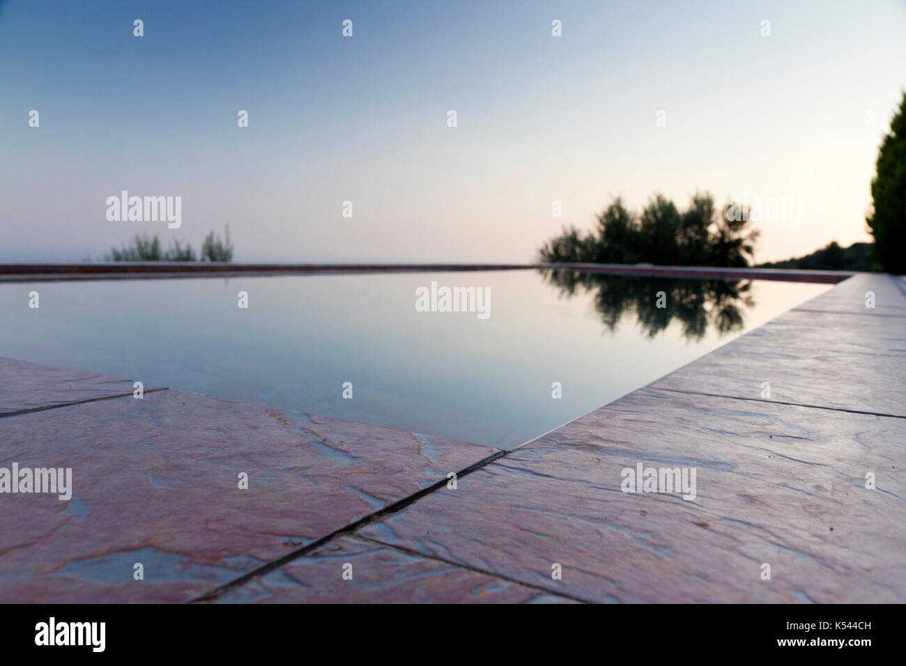 Low wide angle view of luxury swimming pool in early evening Stock ...