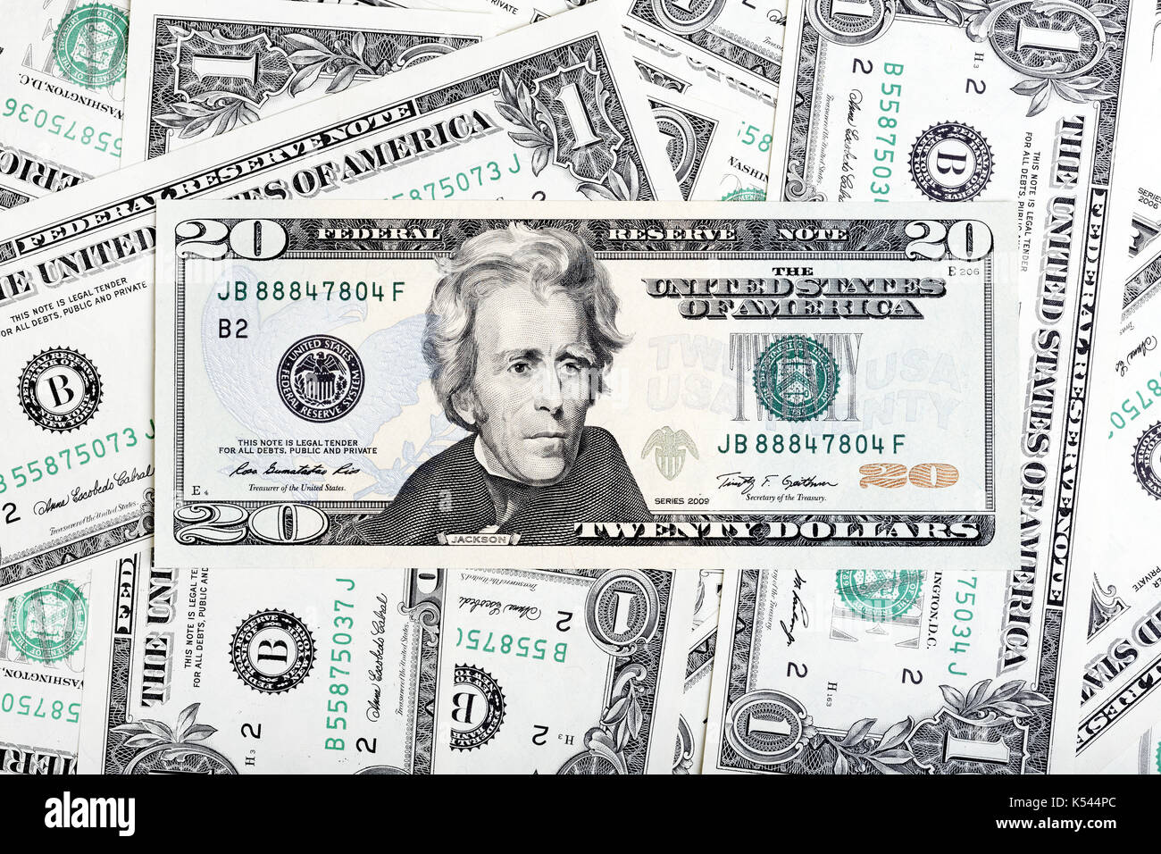 One dollar banknotes and twenty dollar bill close-up shot. High quality ...