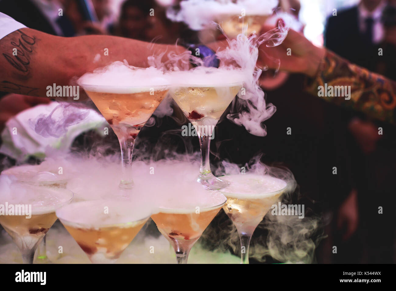 Beautiful line of different coloured alcohol cocktails on a open air ...