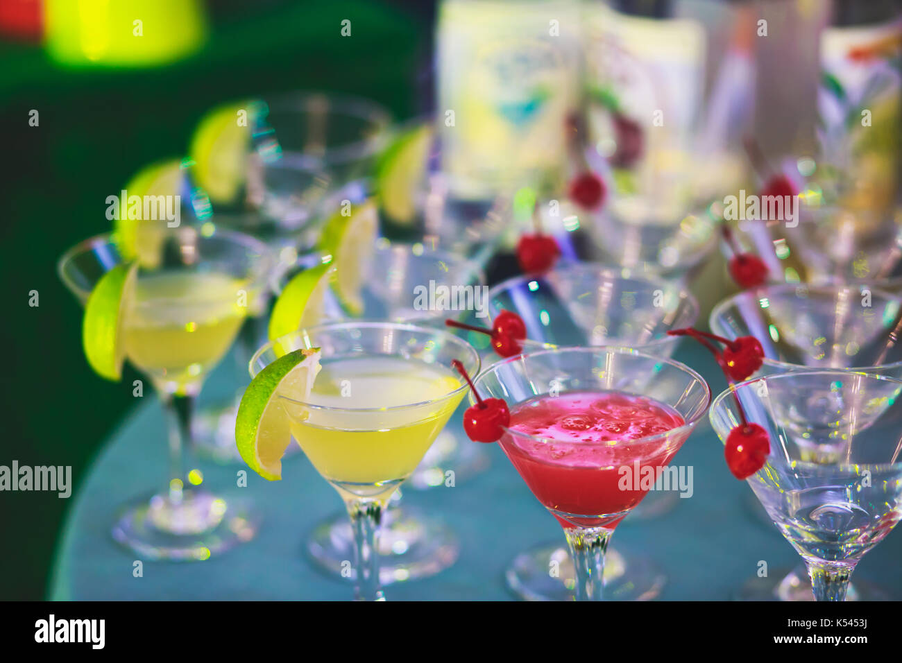 Beautiful line of different coloured alcohol cocktails on a open air ...