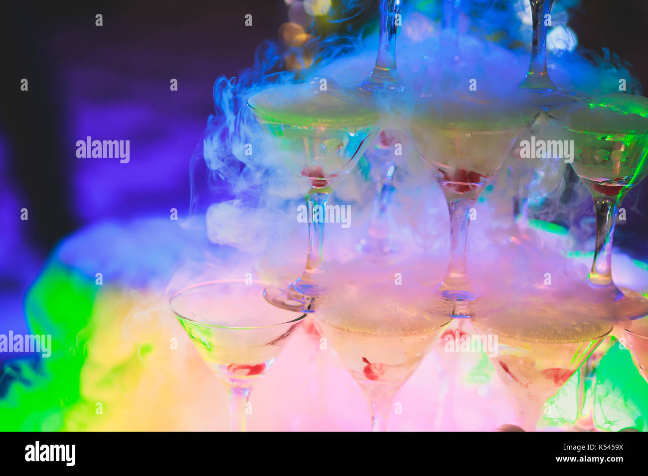 Beautiful line of different coloured alcohol cocktails on a open air ...