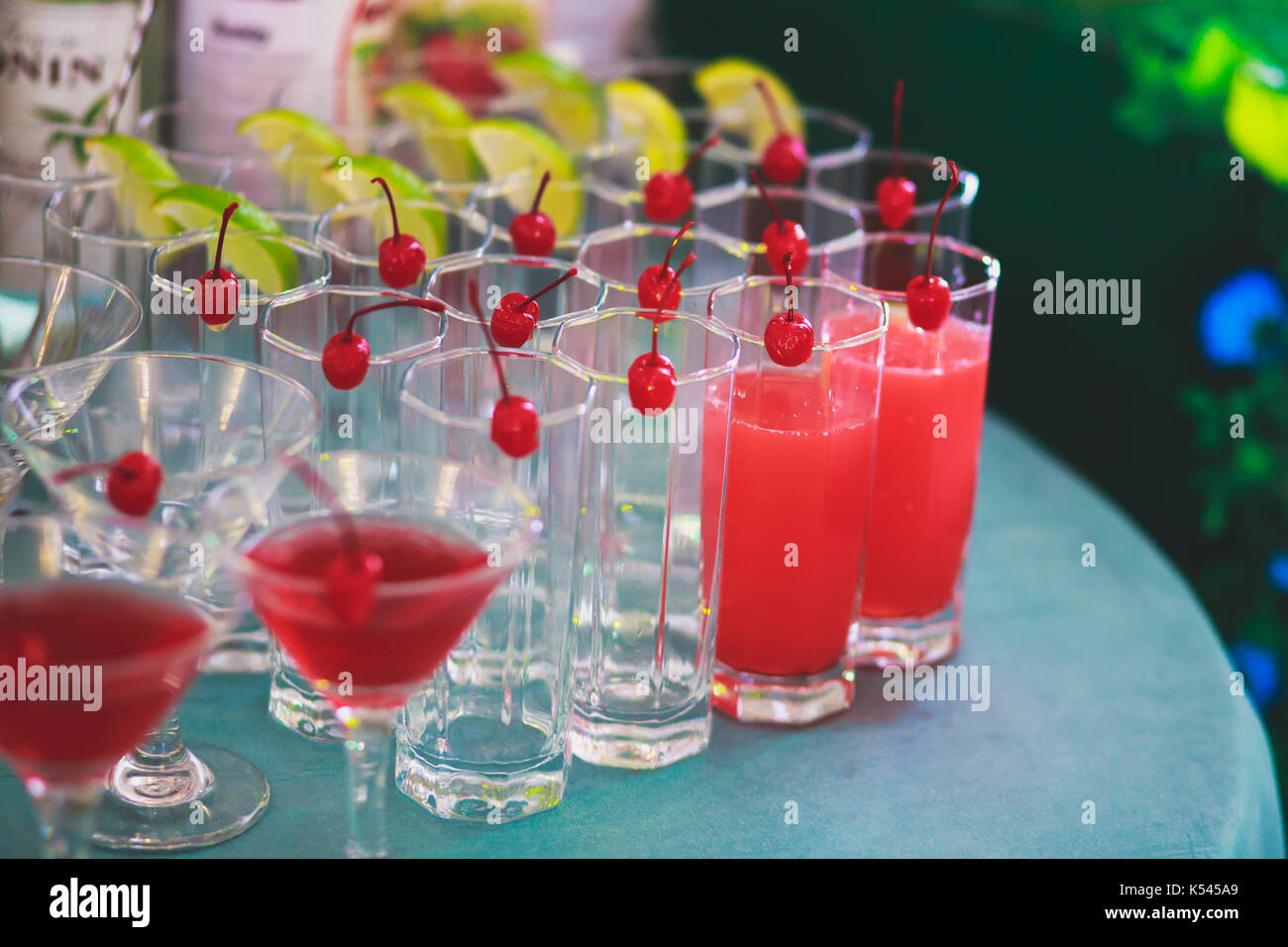 Beautiful line of different coloured alcohol cocktails on a open air ...