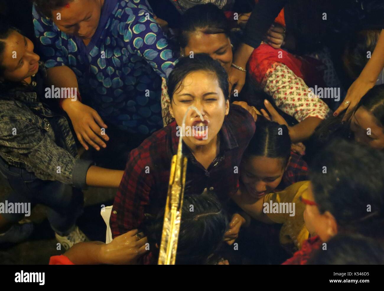 Kathmandu, Nepal. 07th Sep, 2017. Nepalese struggle to drink homemade ...