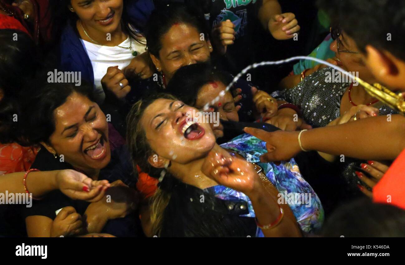 Kathmandu, Nepal. 07th Sep, 2017. Nepalese struggle to drink homemade ...