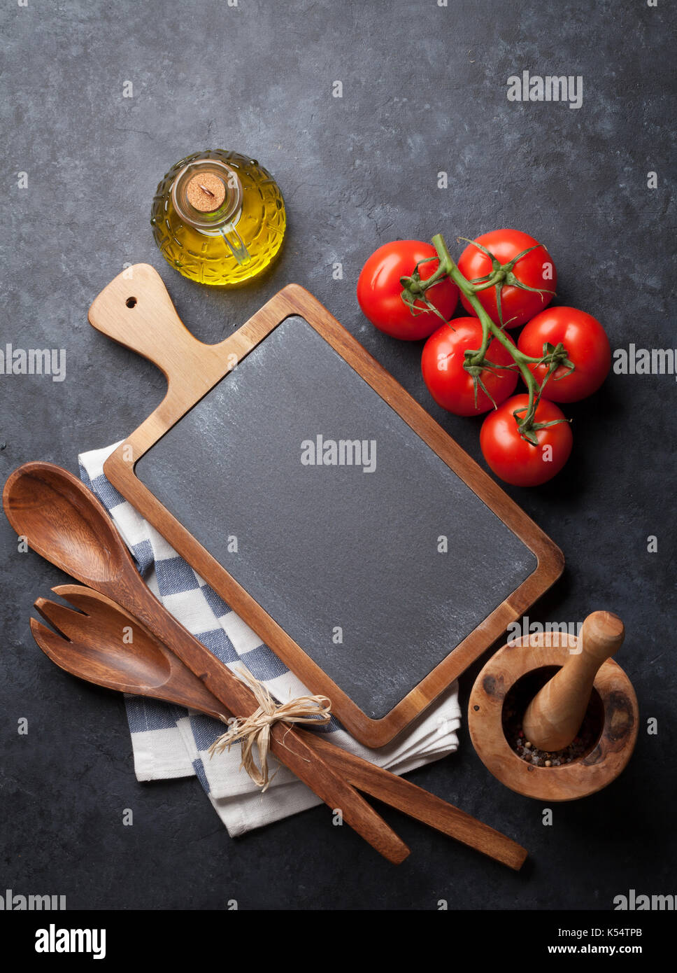 Cooking ingredients and utensils on stone table. Top view with ...
