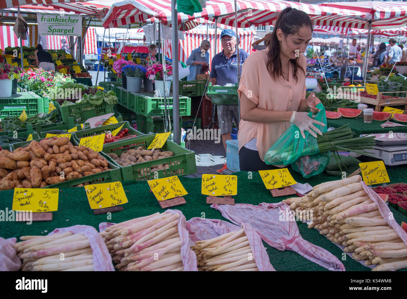 Market stalls selling fresh produce in the Hauptmarkt or market square ...