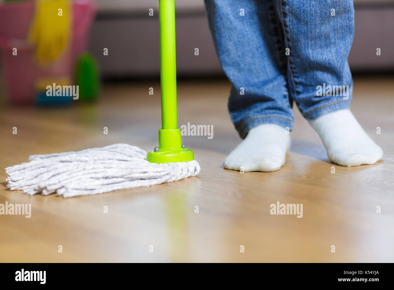 woman holding mop in the home Stock Photo - Alamy
