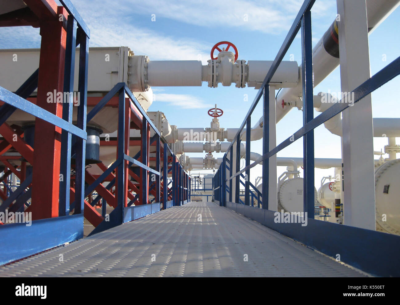 Steel service platform and stairs. Equipment refinery Stock Photo - Alamy
