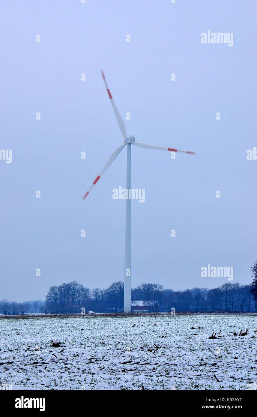 Tall wind generators producing energy, here in the German countryside ...