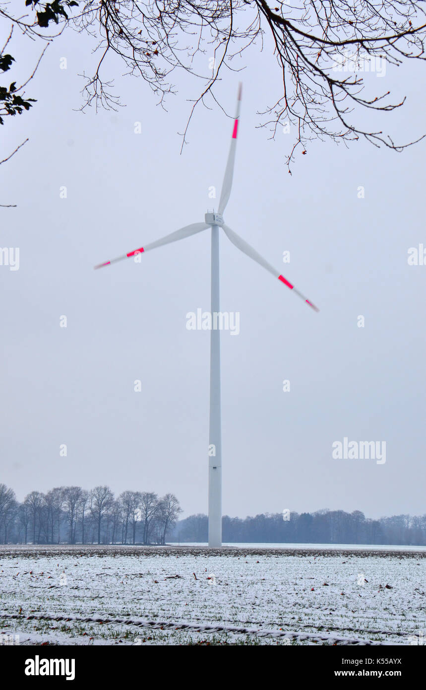 Tall wind generators producing energy, here in the German countryside ...