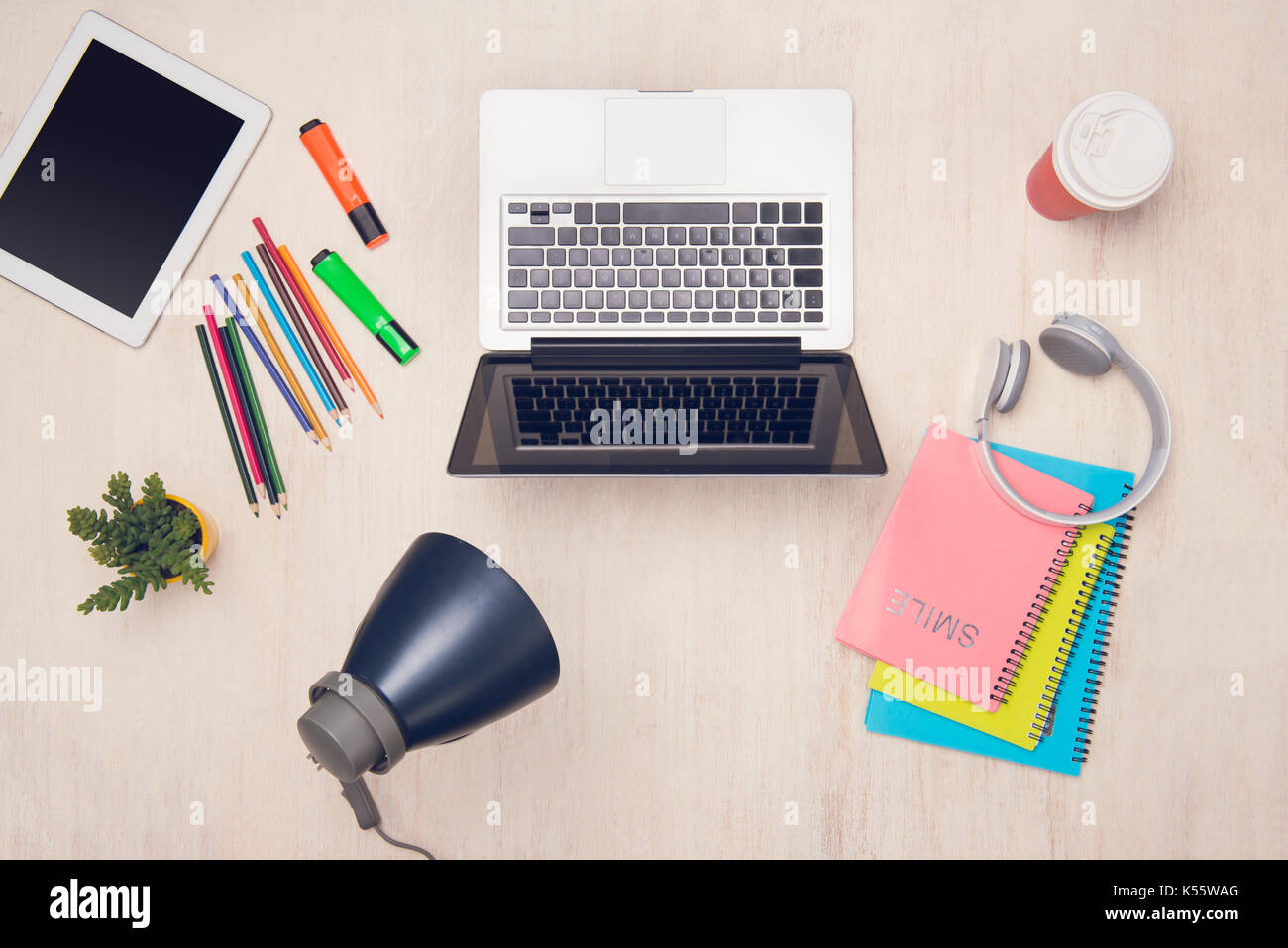 Desk with stationary and laptop on wooden background Stock Photo - Alamy