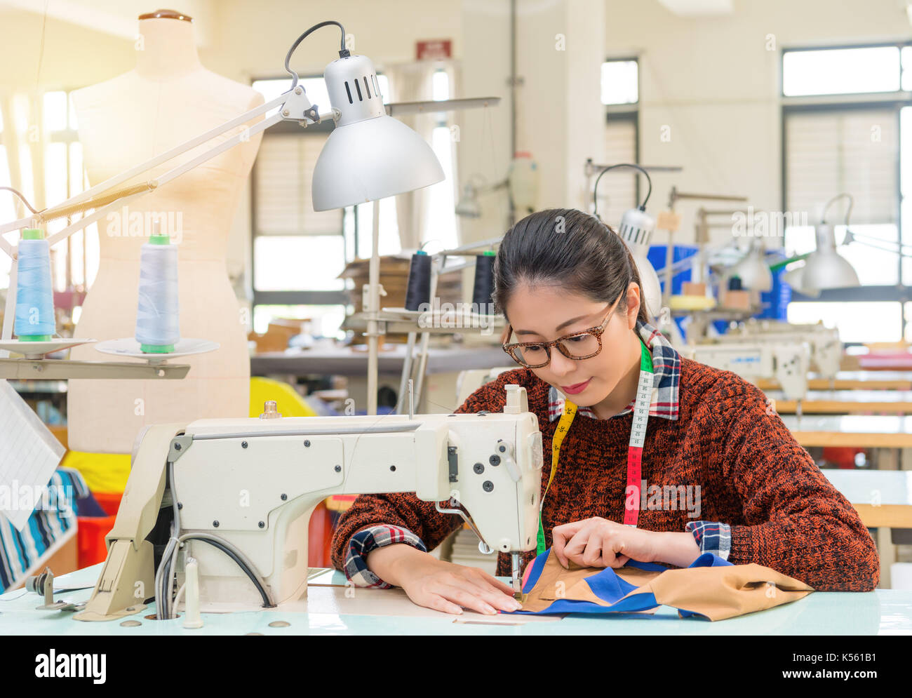 Female designer using sewing machine hi-res stock photography and ...