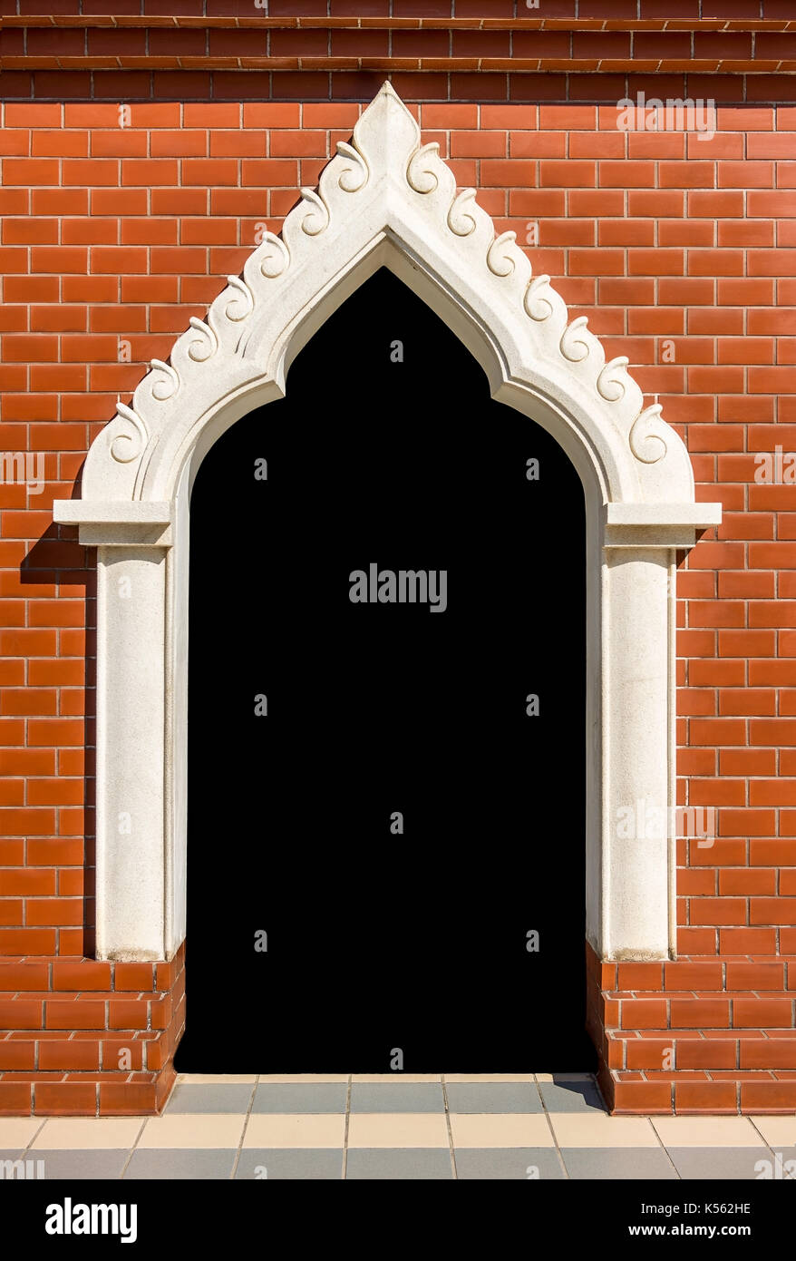 Thai style temple door with brick wall in background with black masking ...