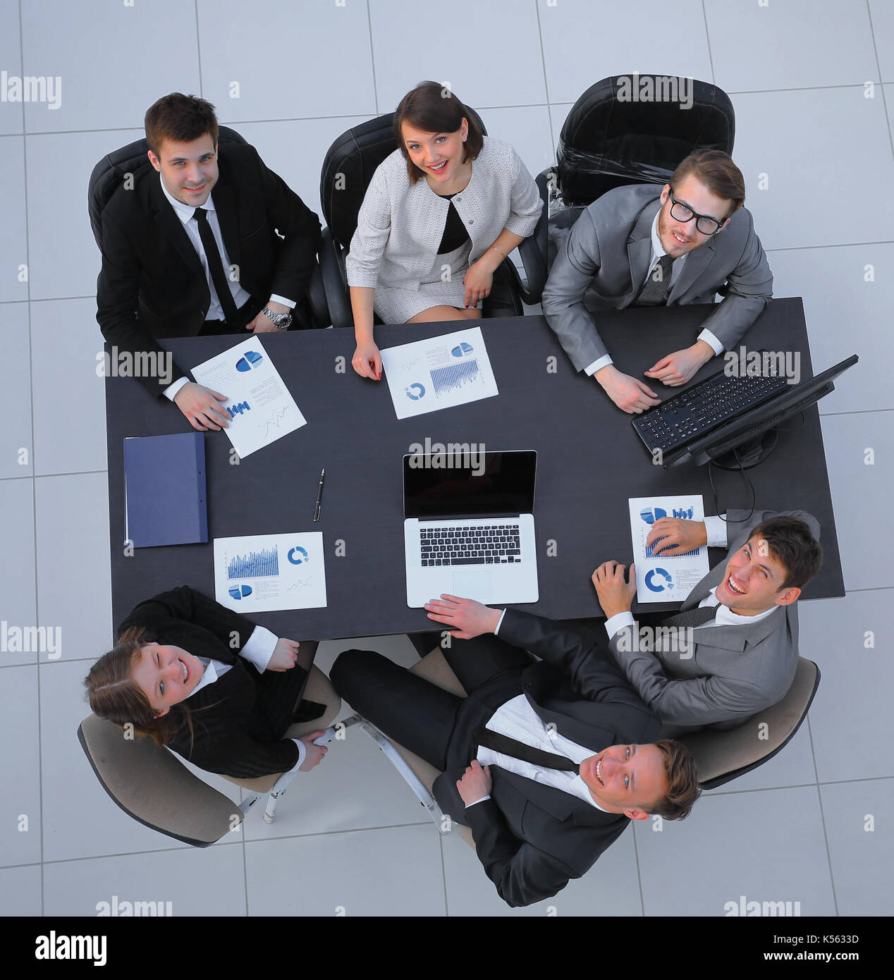team of accountants sitting behind a Desk Stock Photo - Alamy