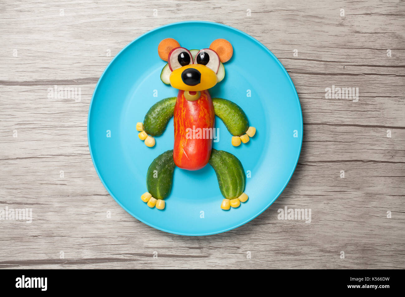 Funny vegetable bear made on plate and table Stock Photo - Alamy