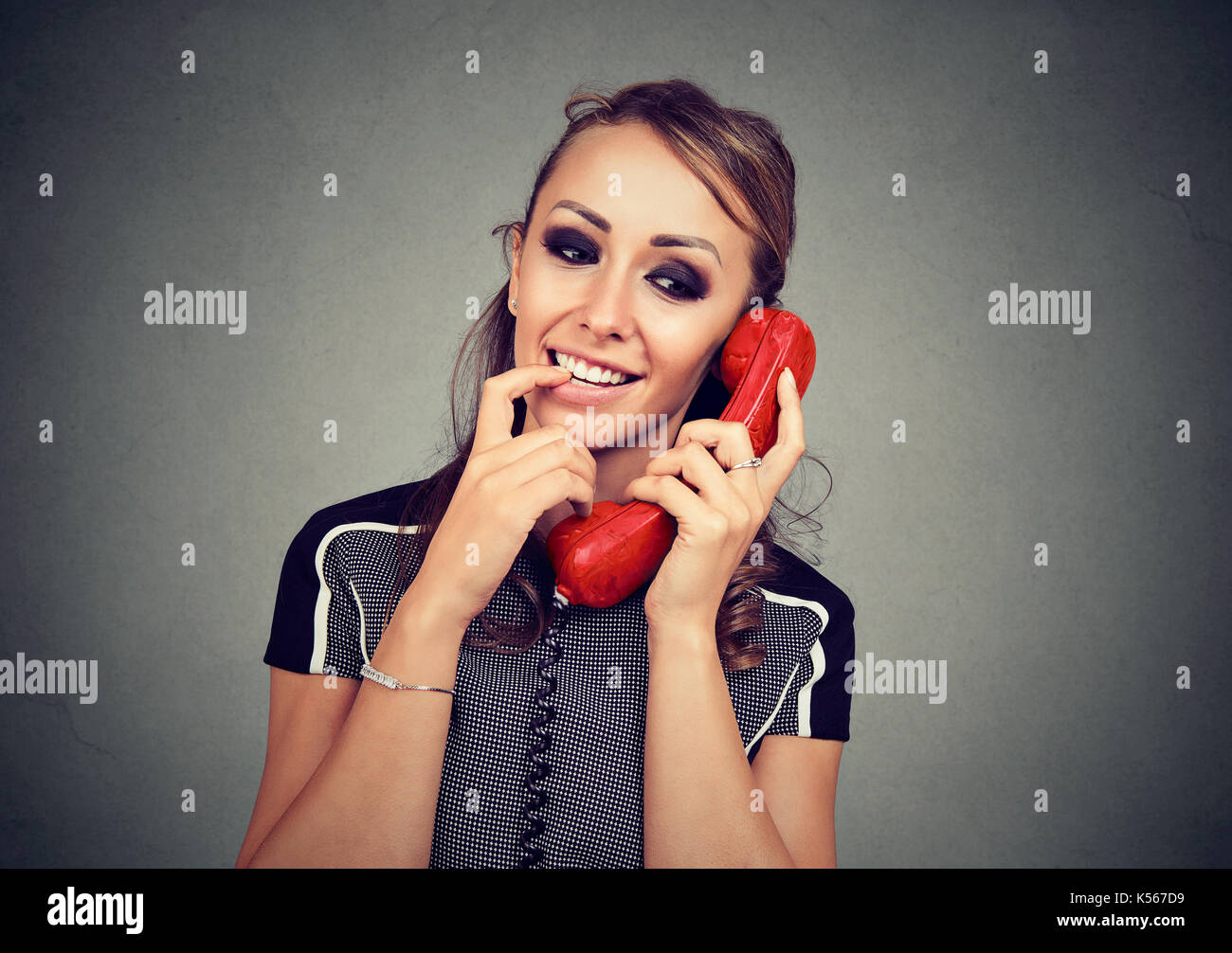 Cute woman having interesting pleasant call Stock Photo - Alamy
