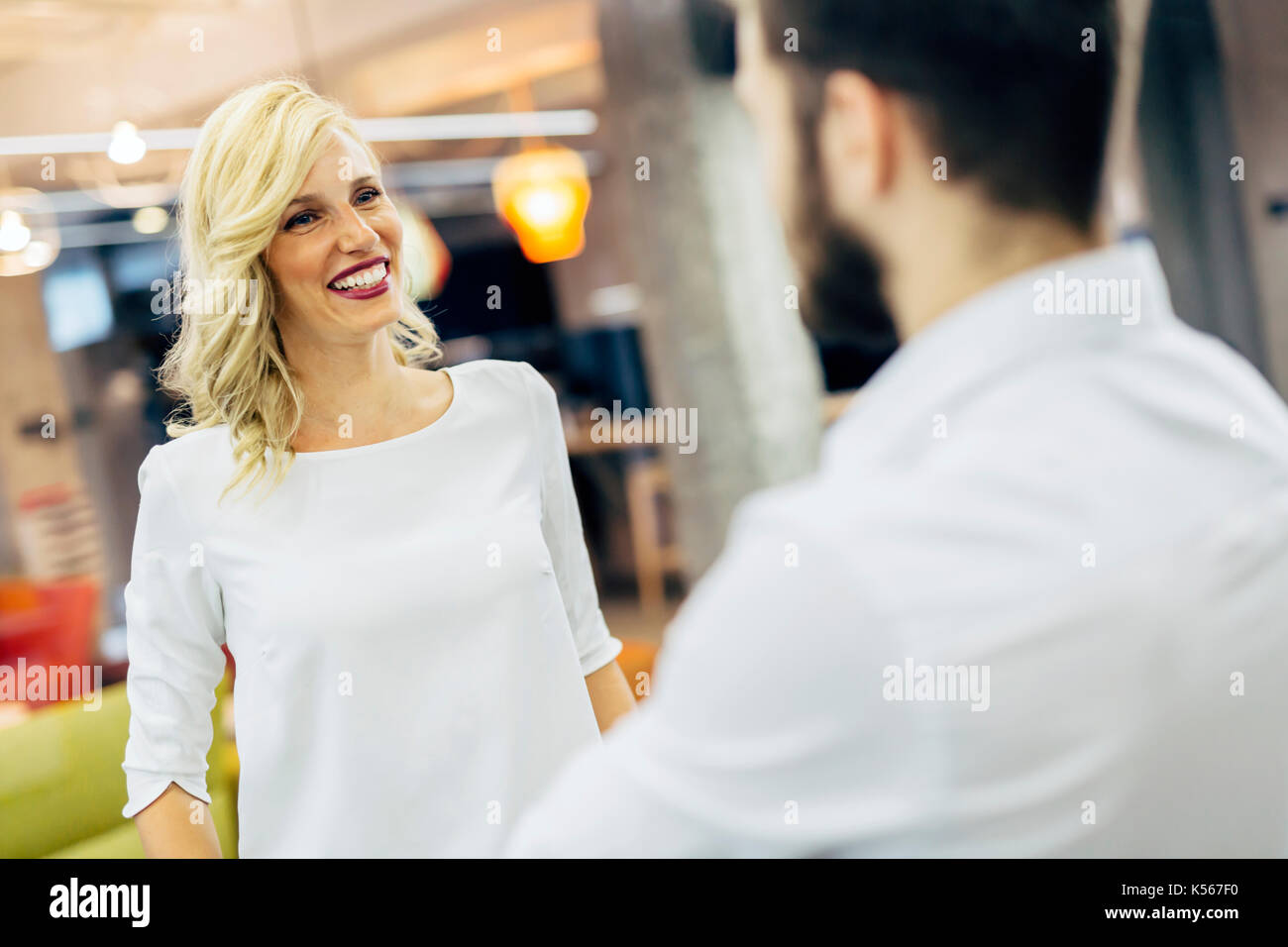 Office talk between coworkers Stock Photo - Alamy