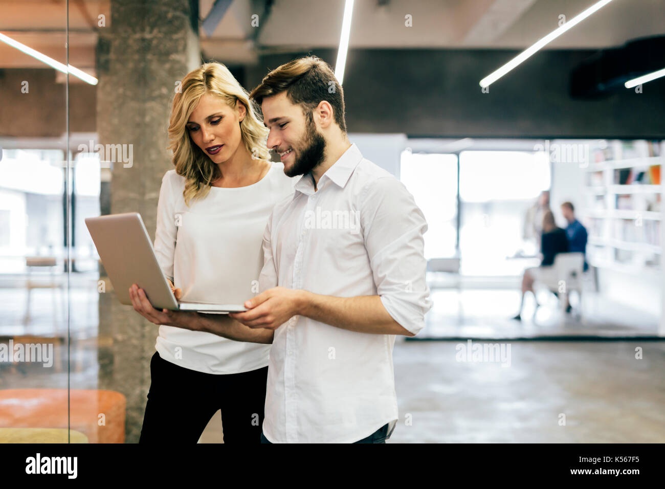 Male and female coworkers hi-res stock photography and images - Alamy