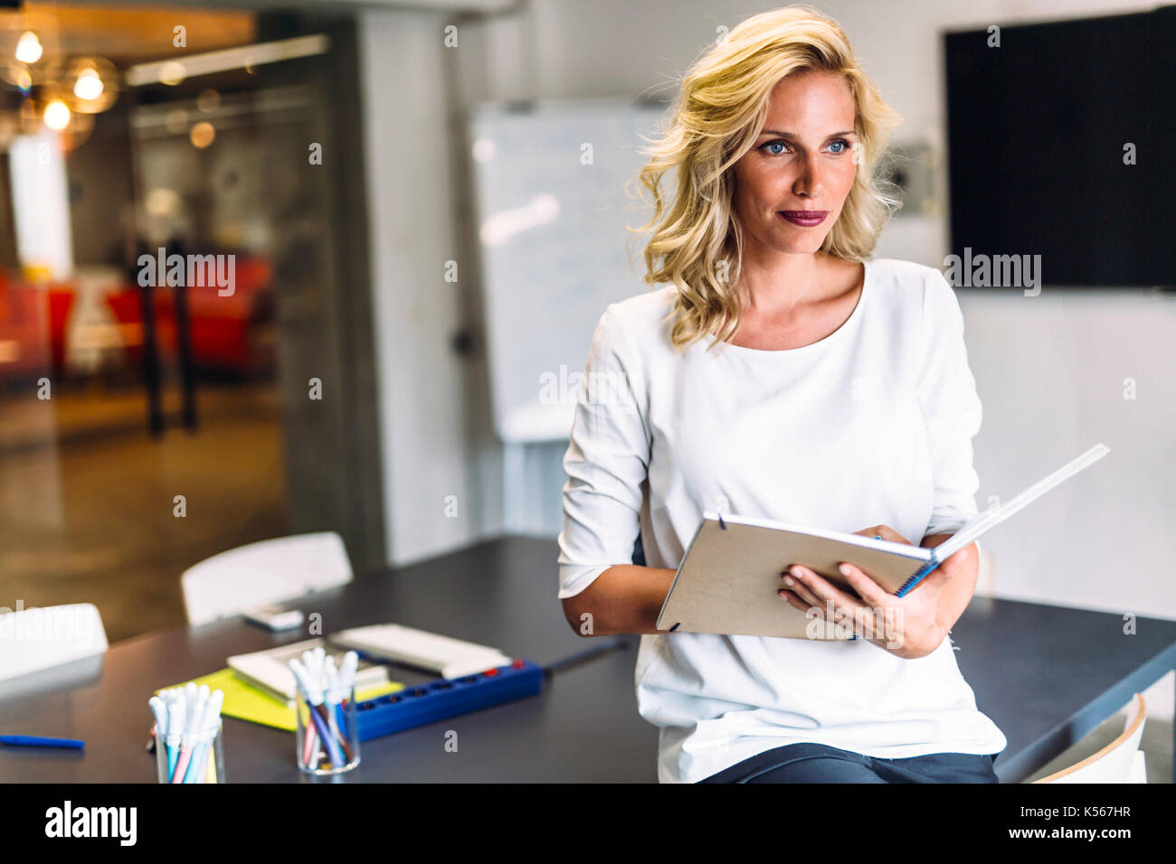 Beautiful woman educating herself Stock Photo - Alamy