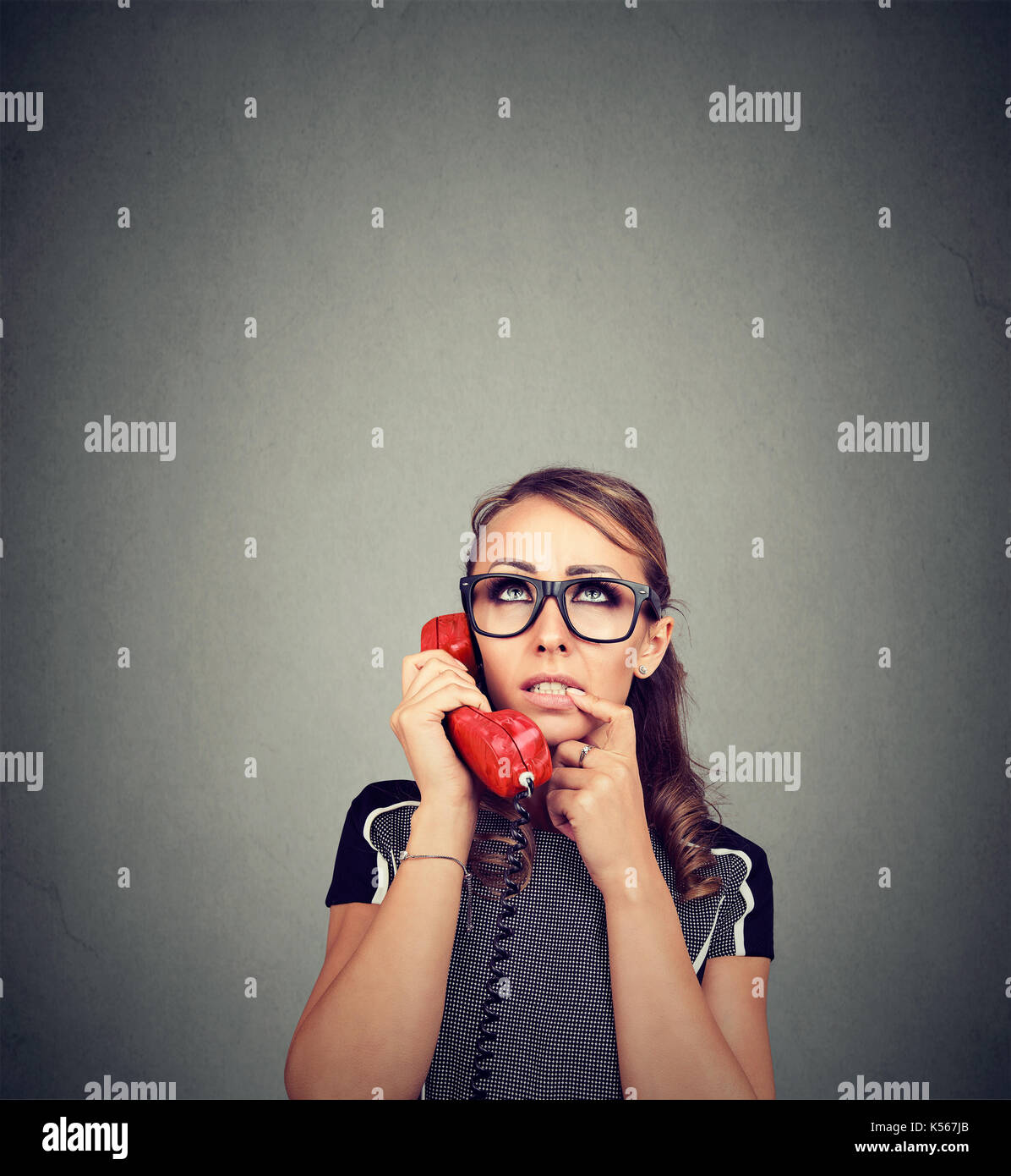 Worried perplexed woman on the phone Stock Photo - Alamy