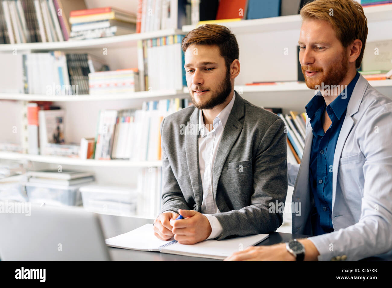 Portrait happy colleagues desk hi-res stock photography and images - Alamy