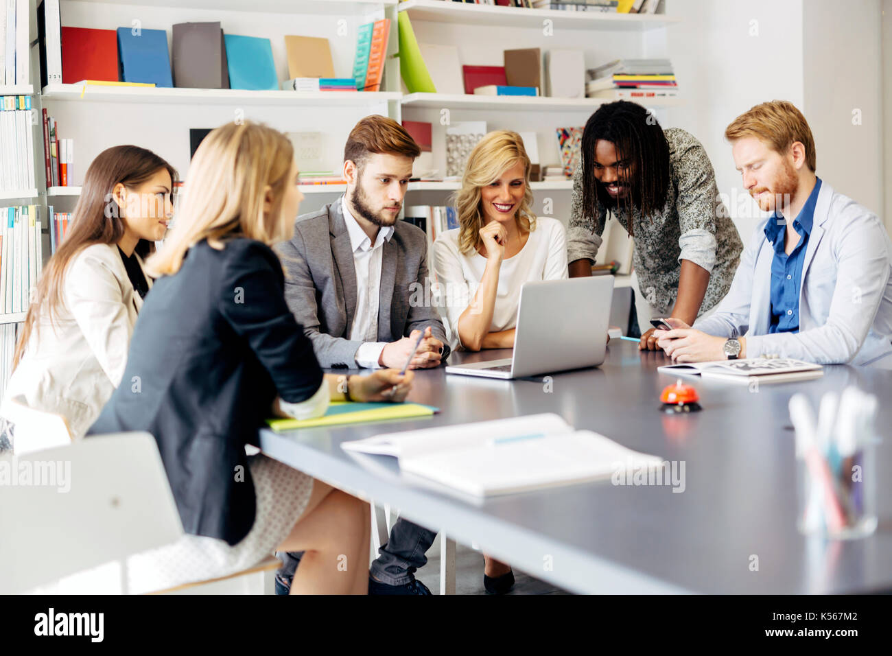Team of architects discussing future plans Stock Photo - Alamy