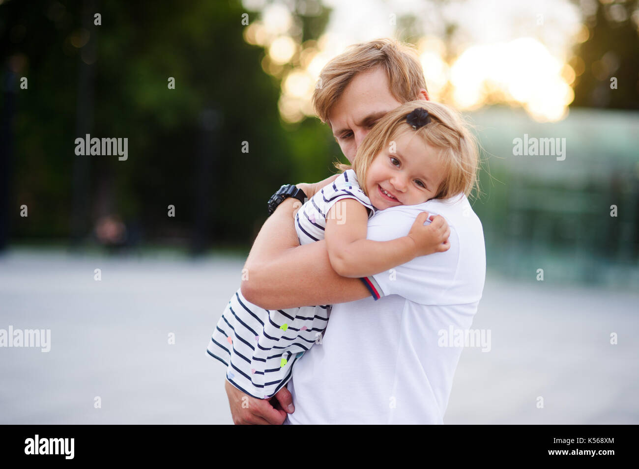 Kid touching shoulder hi-res stock photography and images - Alamy