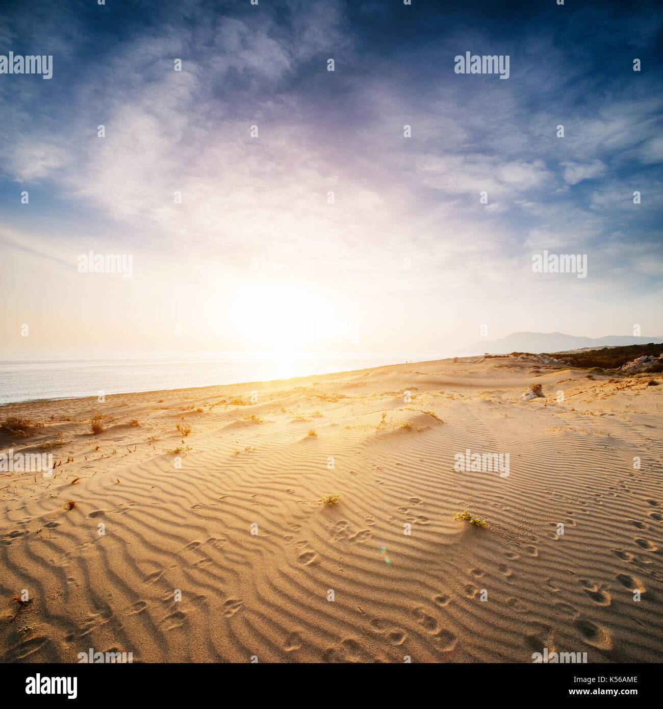 Colorful sunset over mysterious desert Stock Photo - Alamy
