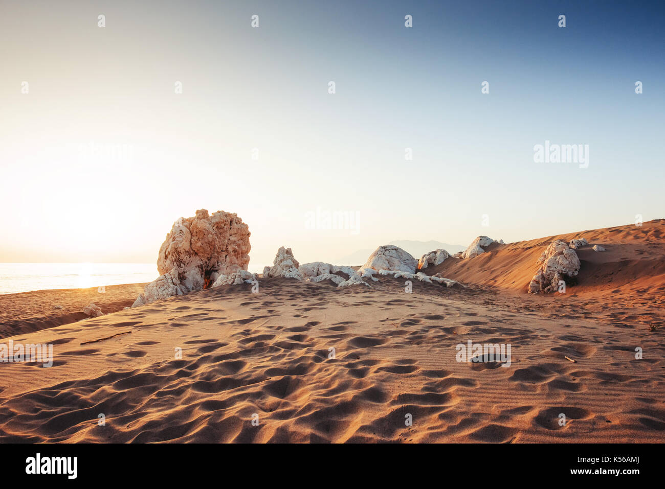 Colorful sunset over mysterious desert Stock Photo - Alamy