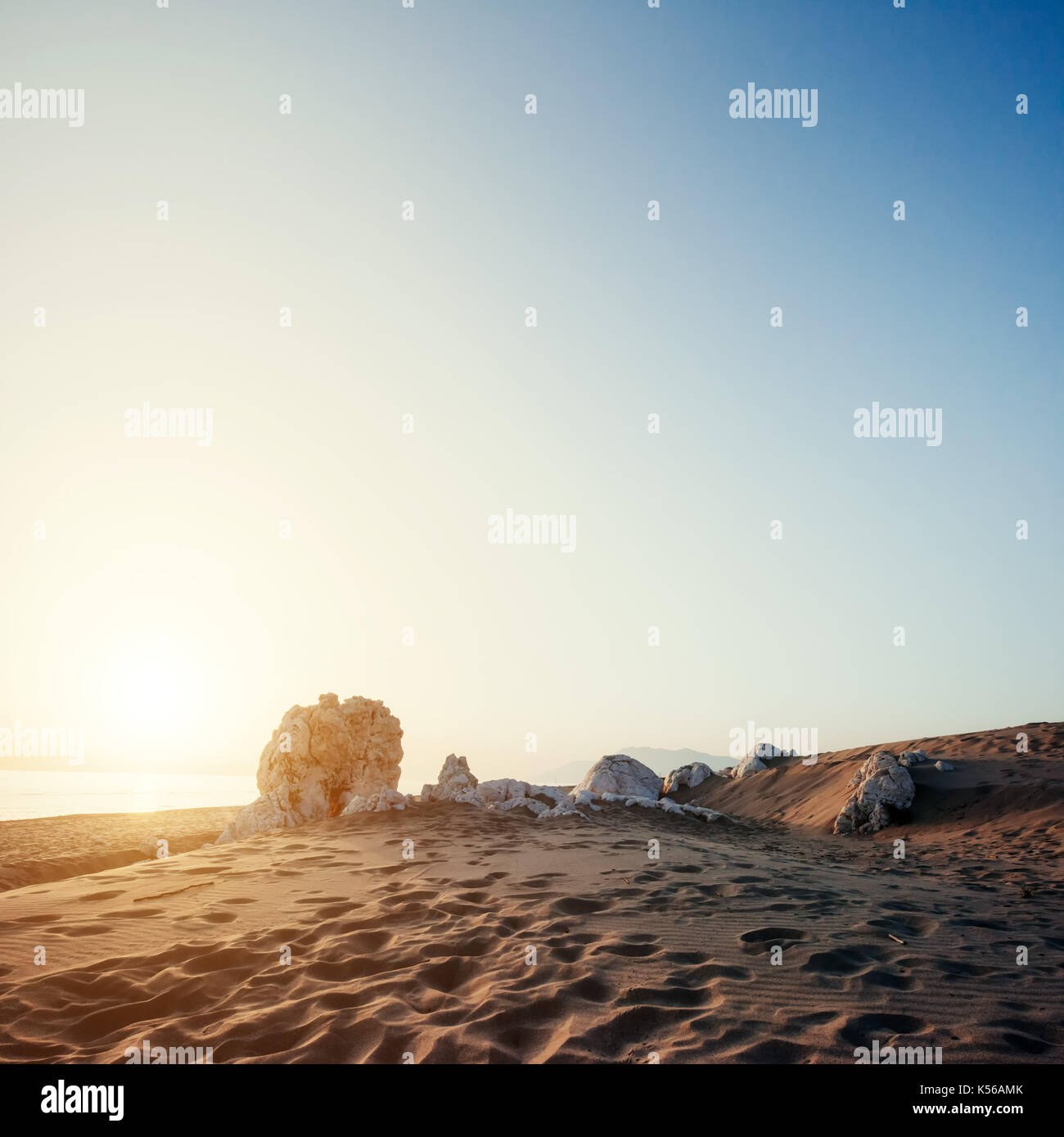 Colorful sunset over mysterious desert Stock Photo - Alamy