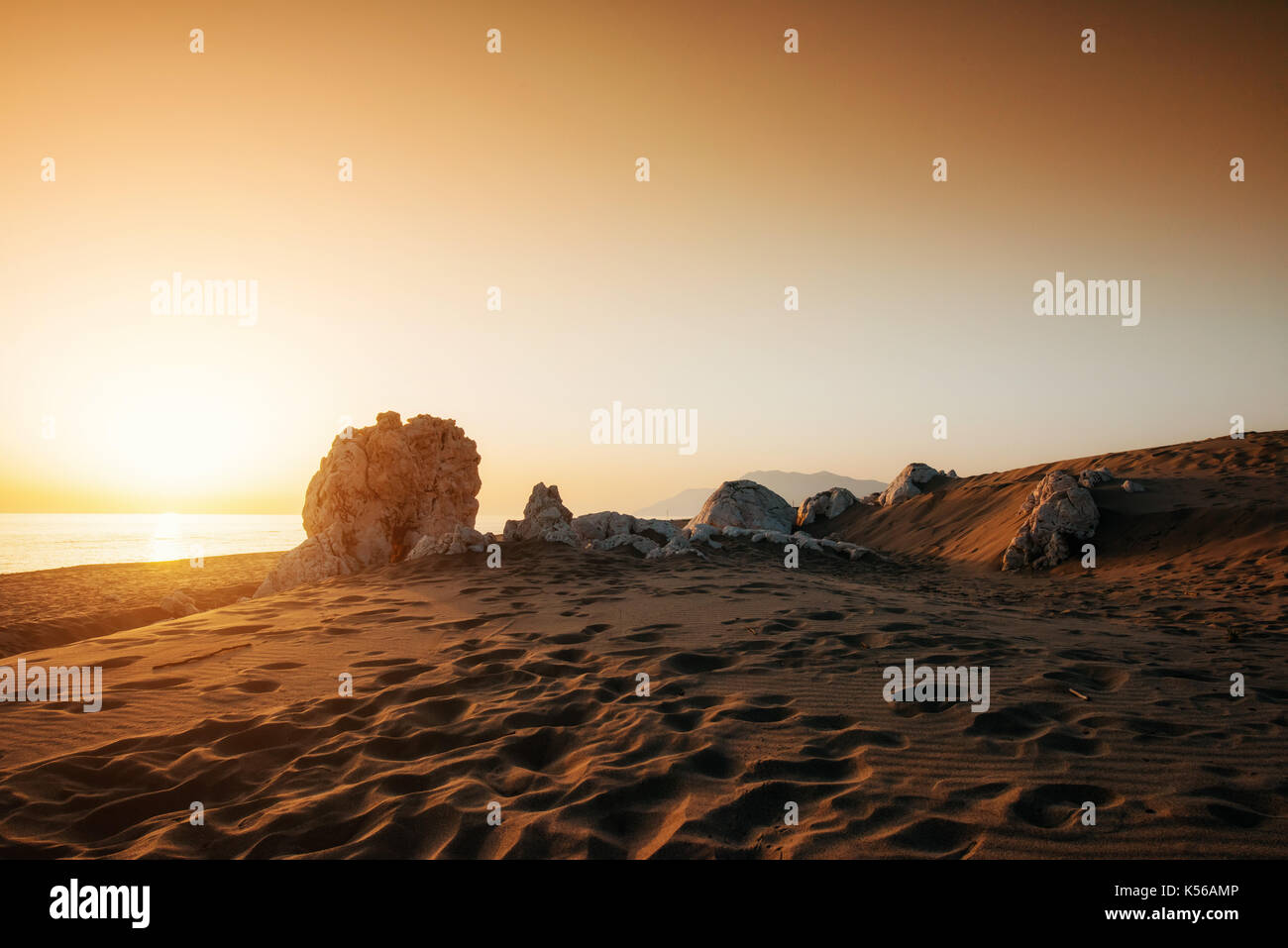 Colorful sunset over mysterious desert Stock Photo - Alamy