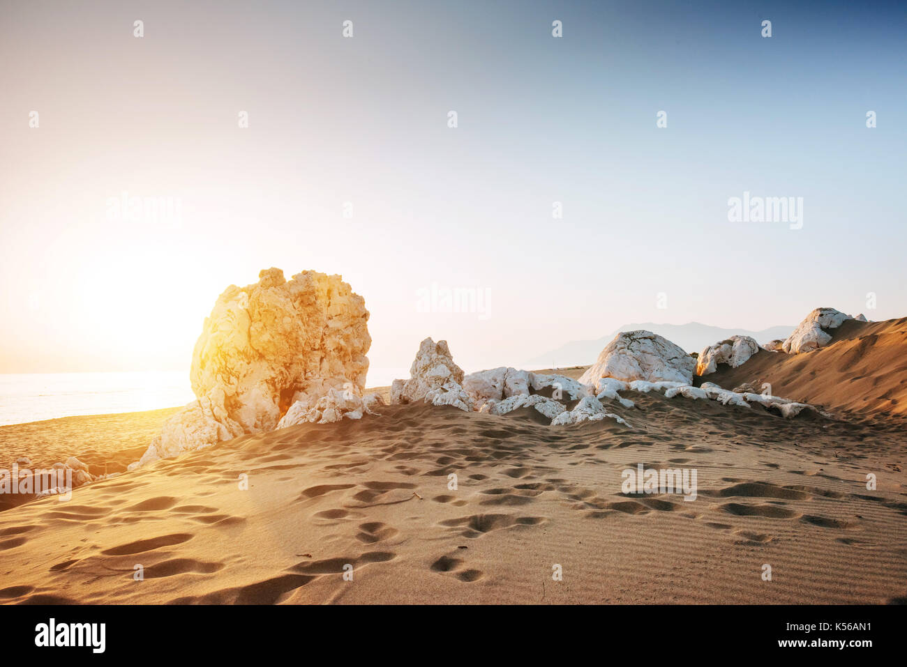 Colorful sunset over mysterious desert Stock Photo - Alamy