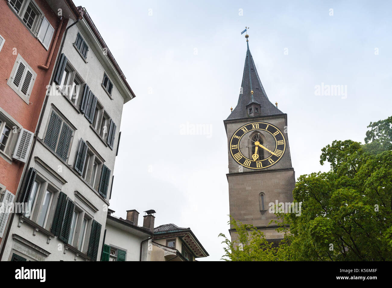 Cityscape of old Zurich, Switzerland. Clock tower of St. Peter church ...