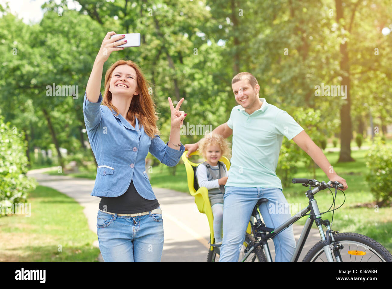 Family riding bike hi-res stock photography and images - Alamy