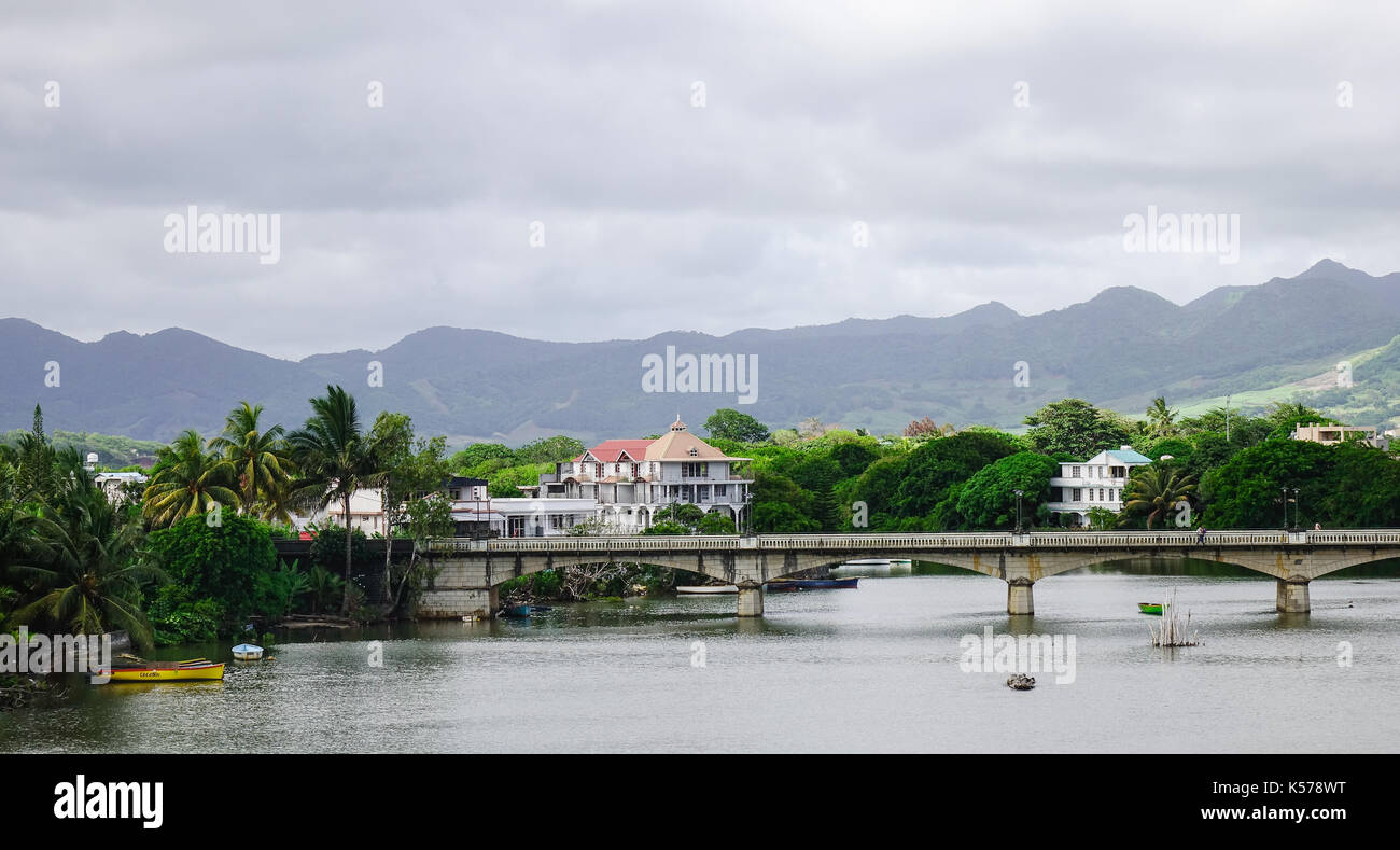 River scene with a bridge in Mahebourg, Mauritius. Mahebourg is a small ...