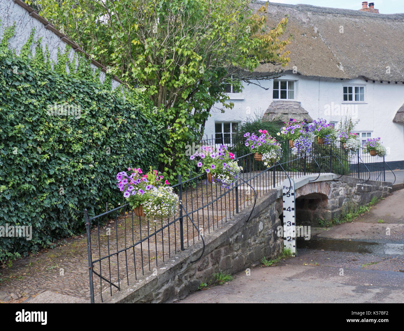 Footbridge and depth indicator for a stream at the edge of a Devon ...