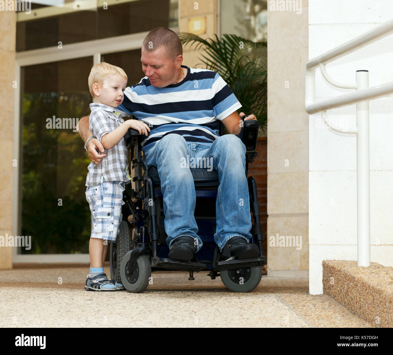 Disabled father play with his little son Stock Photo - Alamy