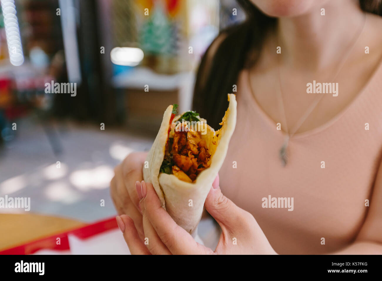 Shawarma in the girl's hand Stock Photo - Alamy