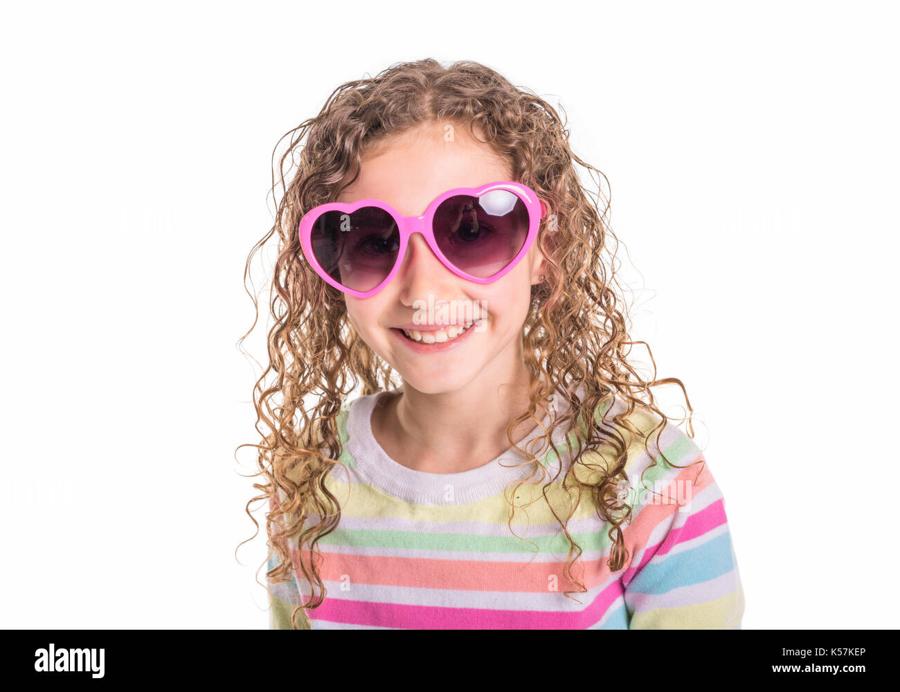 Portrait Of Happy Smiling Confident 9 Years Old Girl With Curly Hair