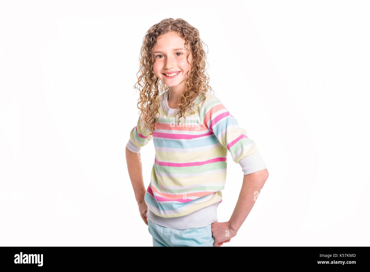 Portrait Of Happy Smiling Confident 9 Years Old Girl With Curly Hair