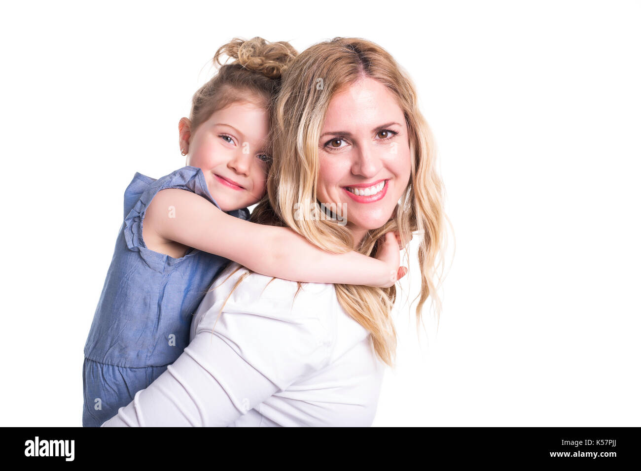 young mother hugging her little daughter isolated on white Stock Photo - Alamy