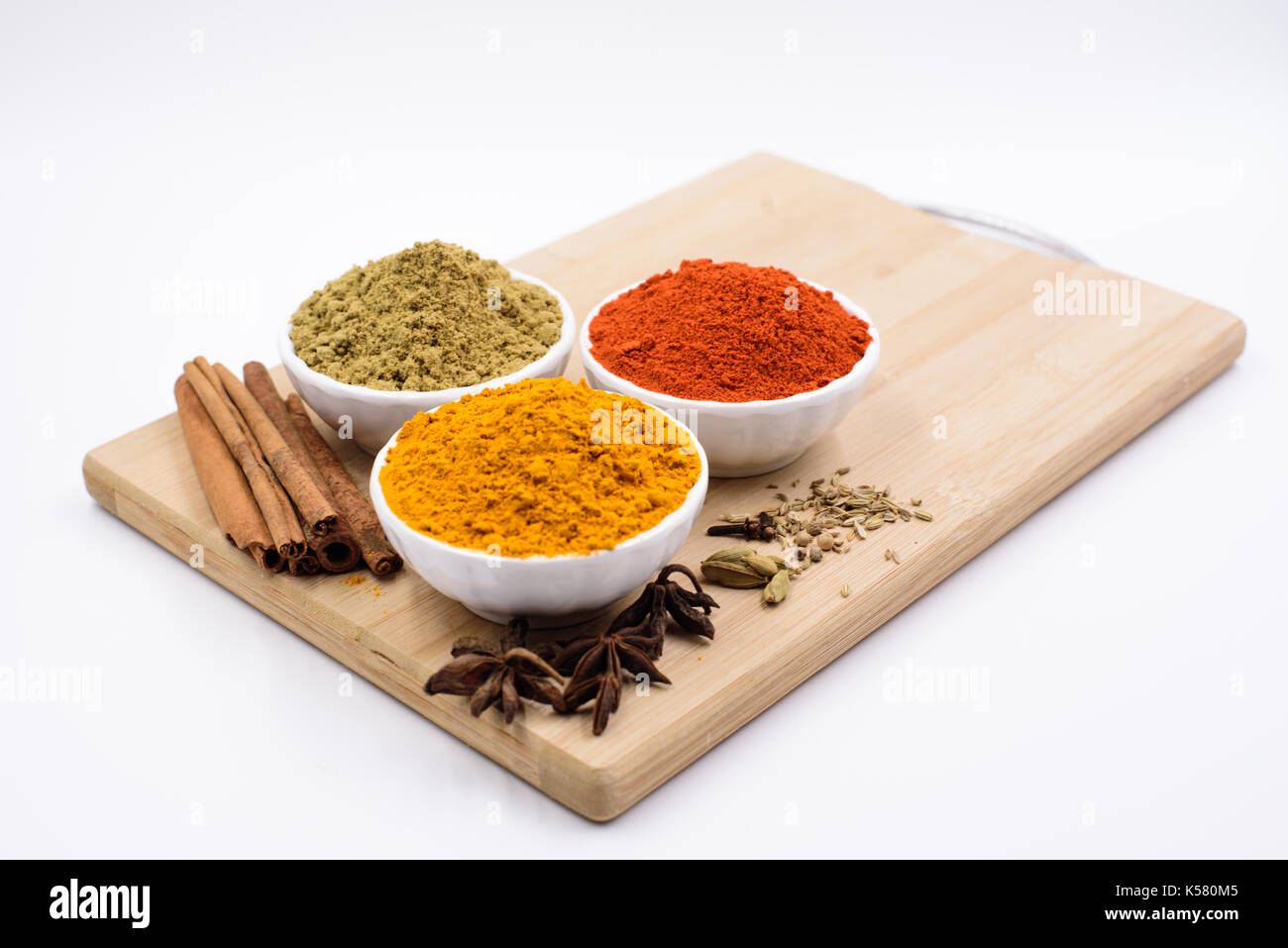 Herbs and spices on a chopping board Stock Photo - Alamy